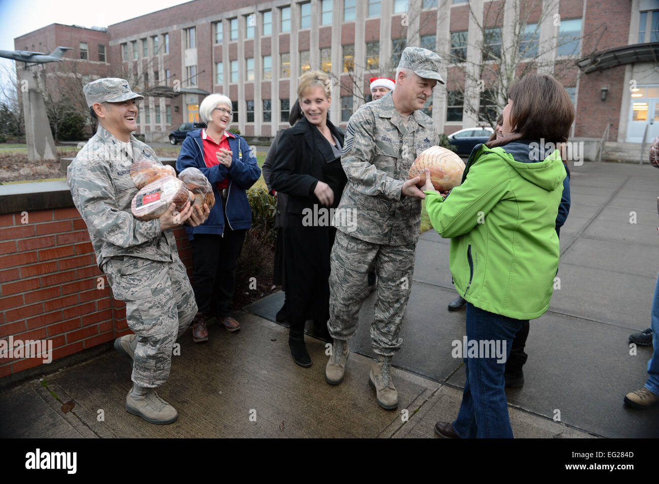 Col. David Kumashiro and Chief Master Sgt. Gordon Drake receive hams ...