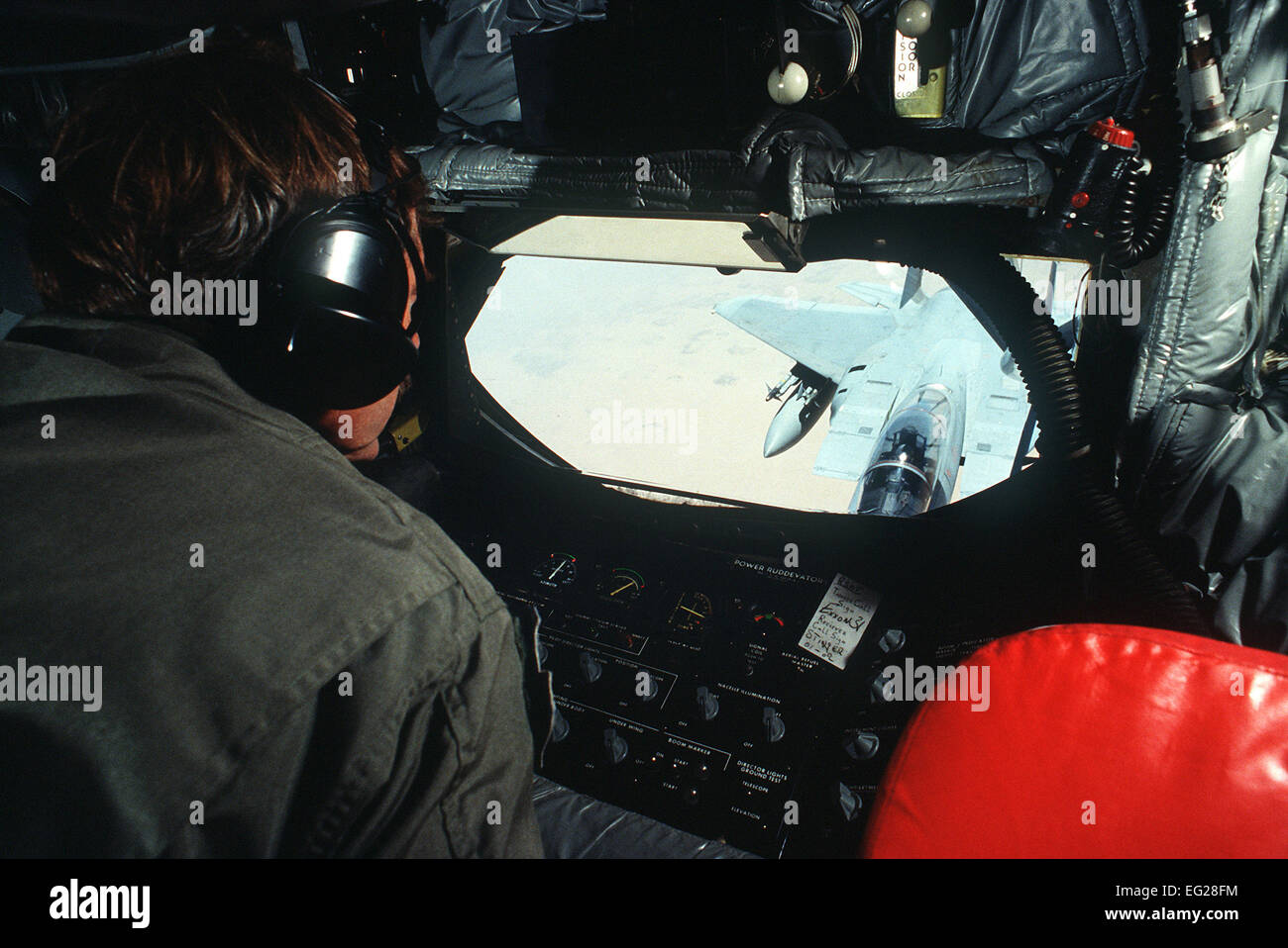The boom operator watches from a KC-135 Stratotanker aircraft as an F ...