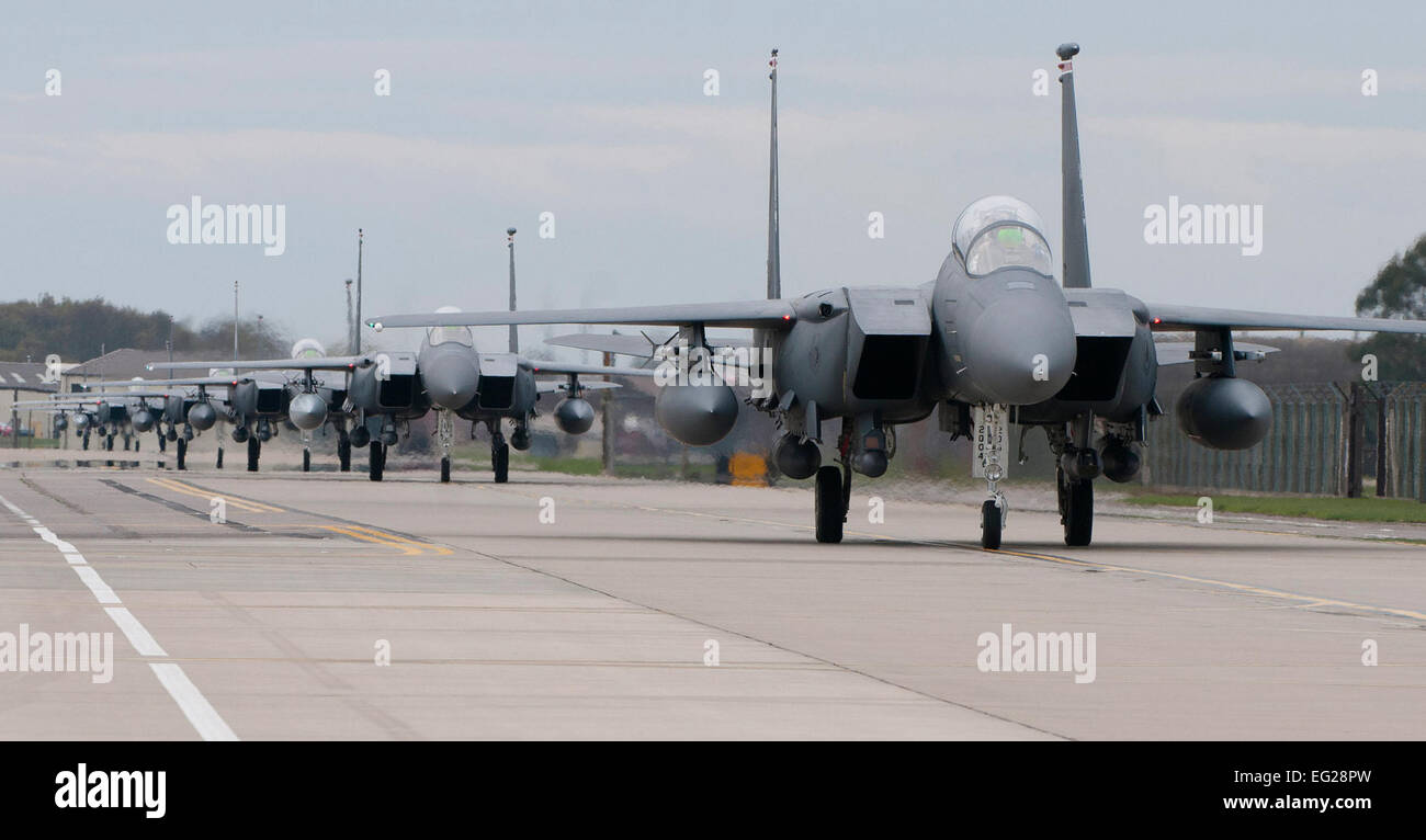 F-15E Strike Eagles from the 494th Fighter Squadron taxi along the ...