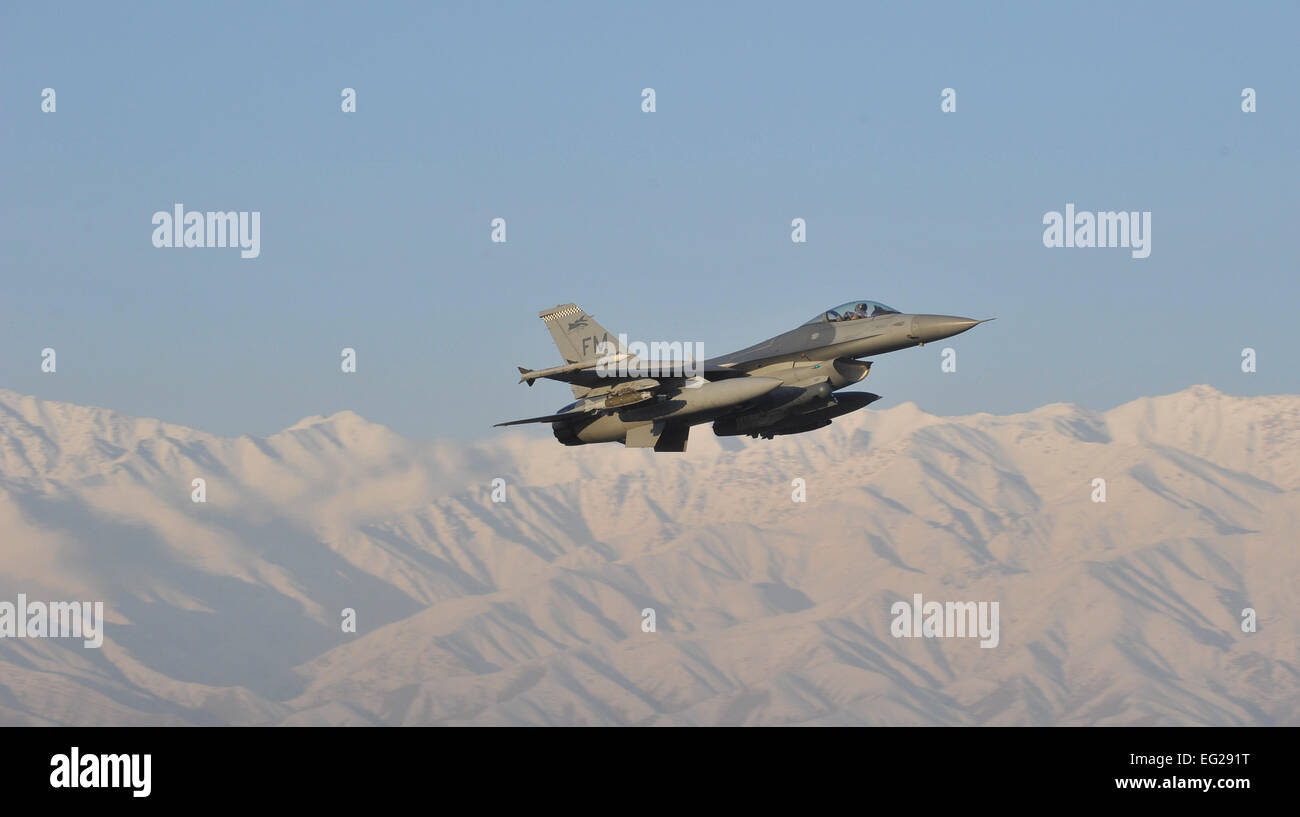 An U.S. Air Force F-16 Fighting Falcon takes off on a mission at dawn ...