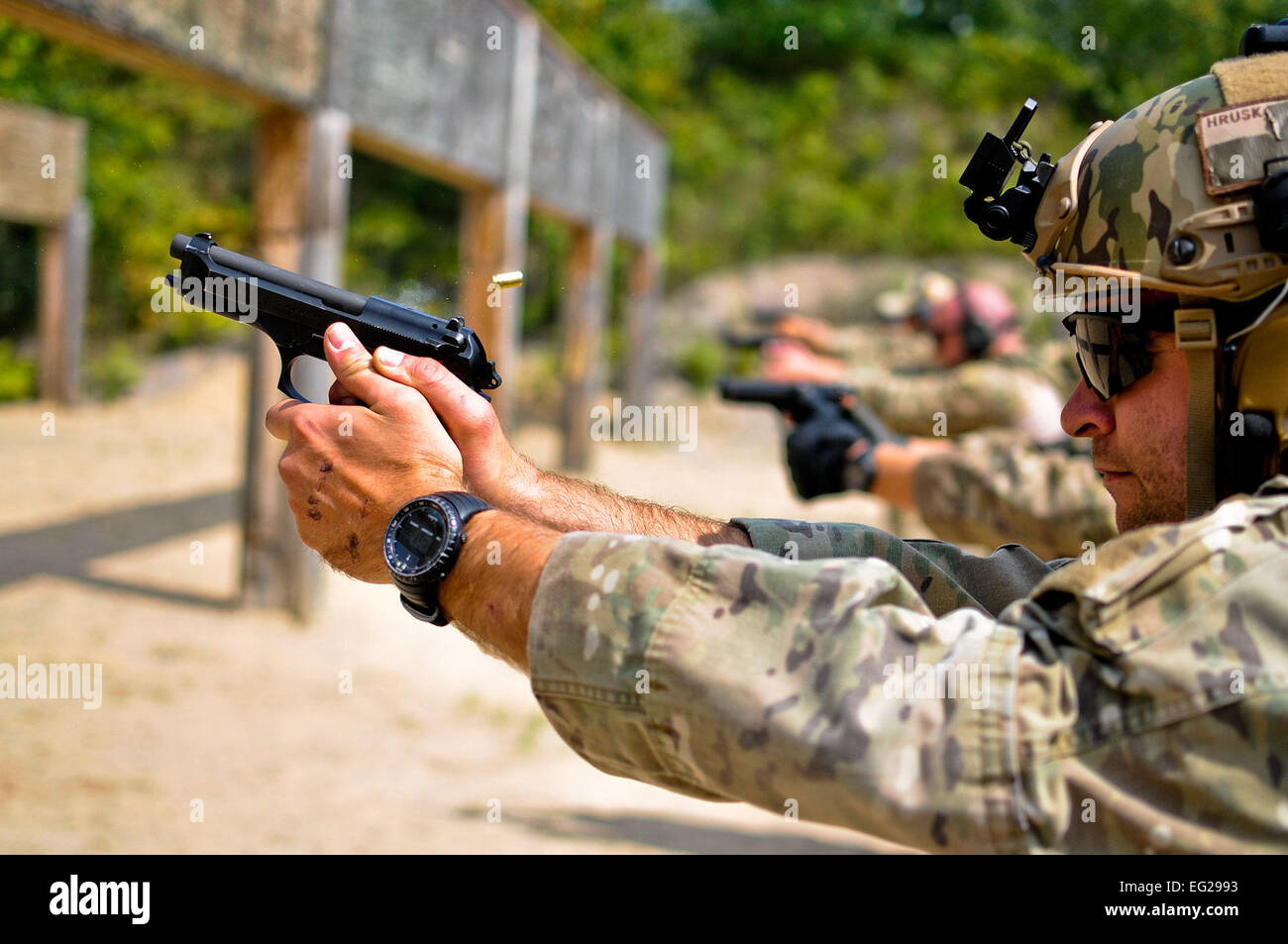 Staff Sgt. Nathan A. Hruska fires his Beretta M9 pistol during a ...