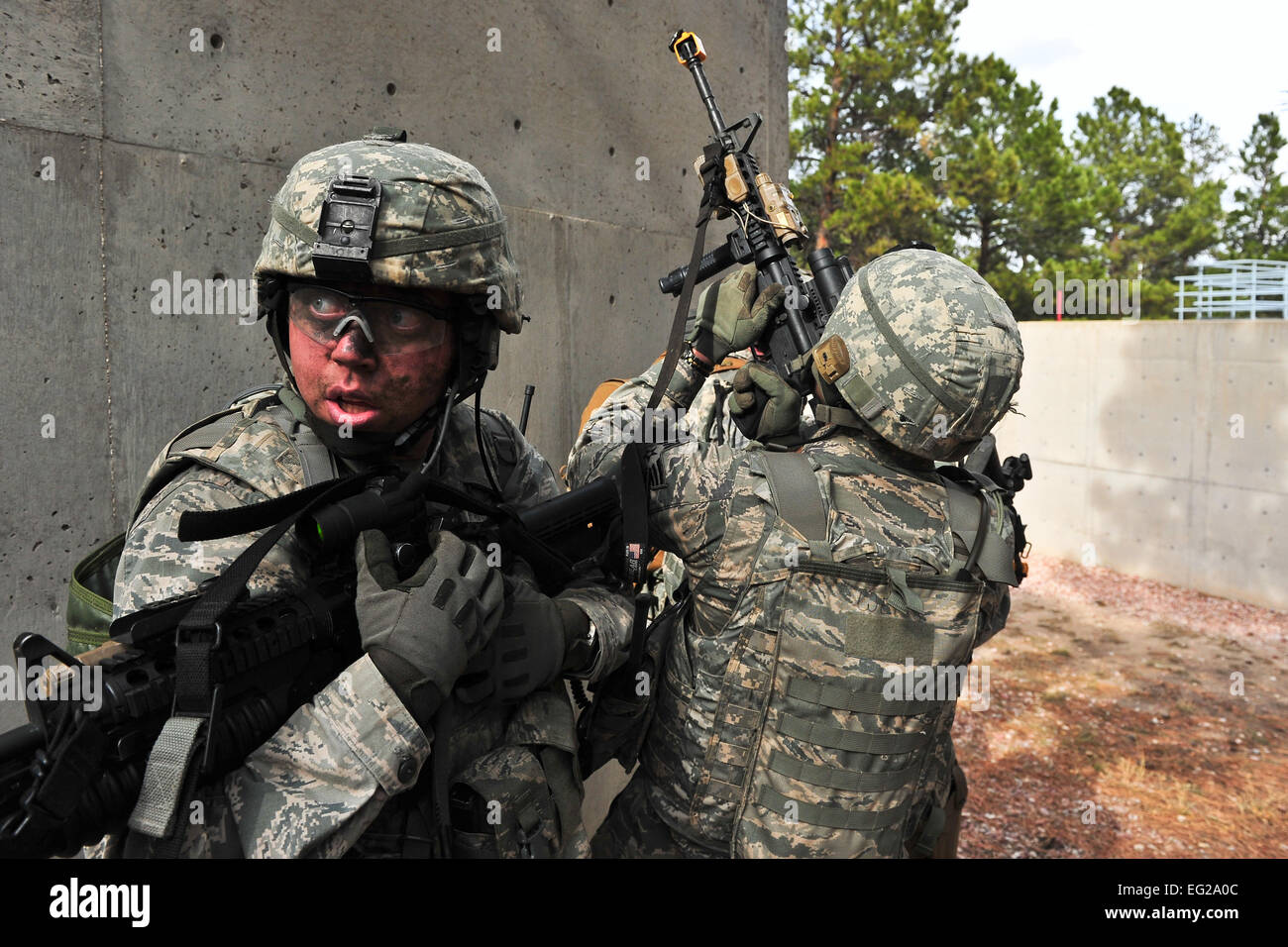 Senior Airman Kurt Jordan, left, provides rear protection against ...