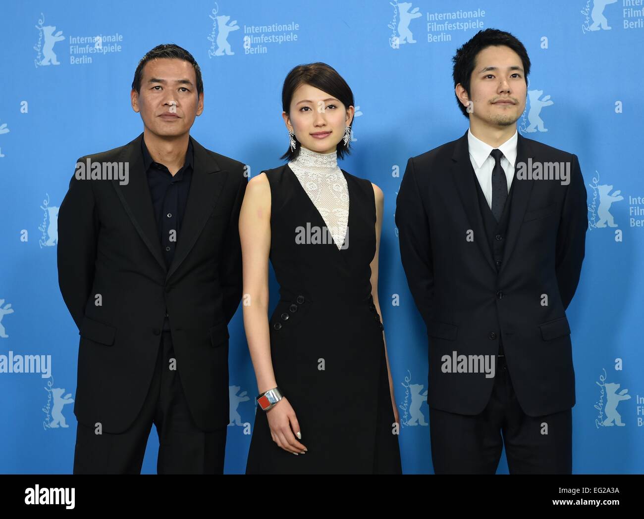 Japanese director Hiroyuki 'Sabu' Tanaka poses next to actors Ito Ohno ...