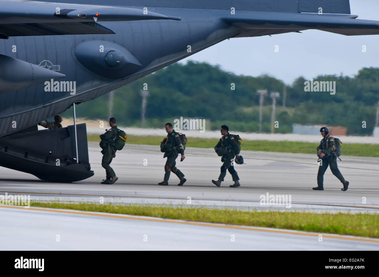 Members of the 736th Security Force Squadron board a C-130 Hercules Aug ...