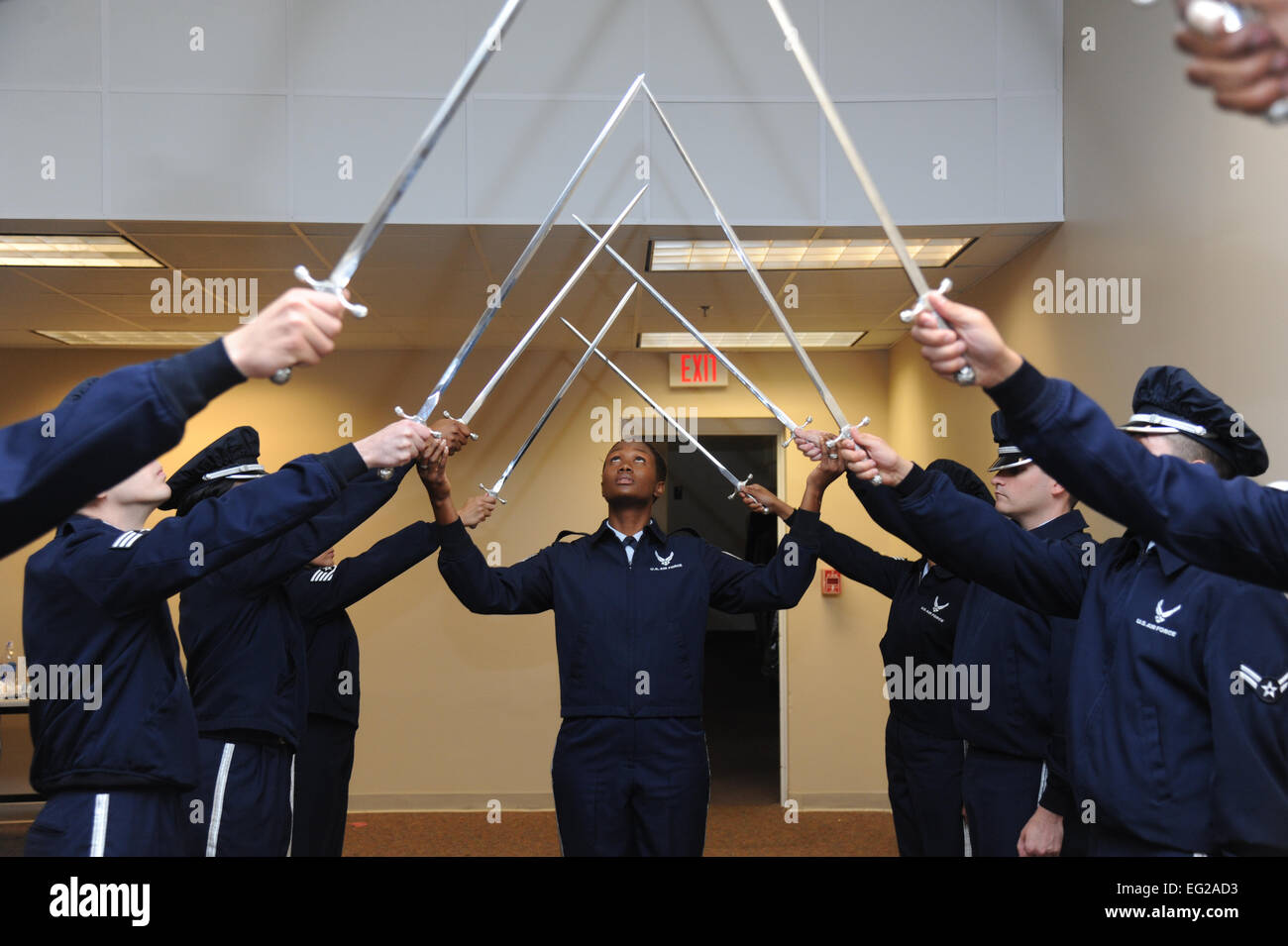 Keesler Honor Guard member Tech. Sgt. Amber Davis positions sabers ...