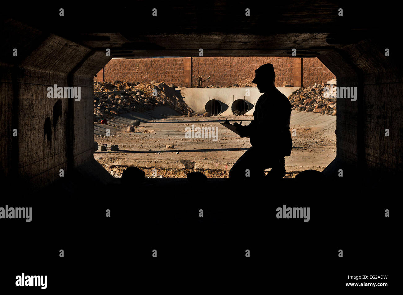 An Airman from the 99th Civil Engineer Squadron surveys the concrete ...