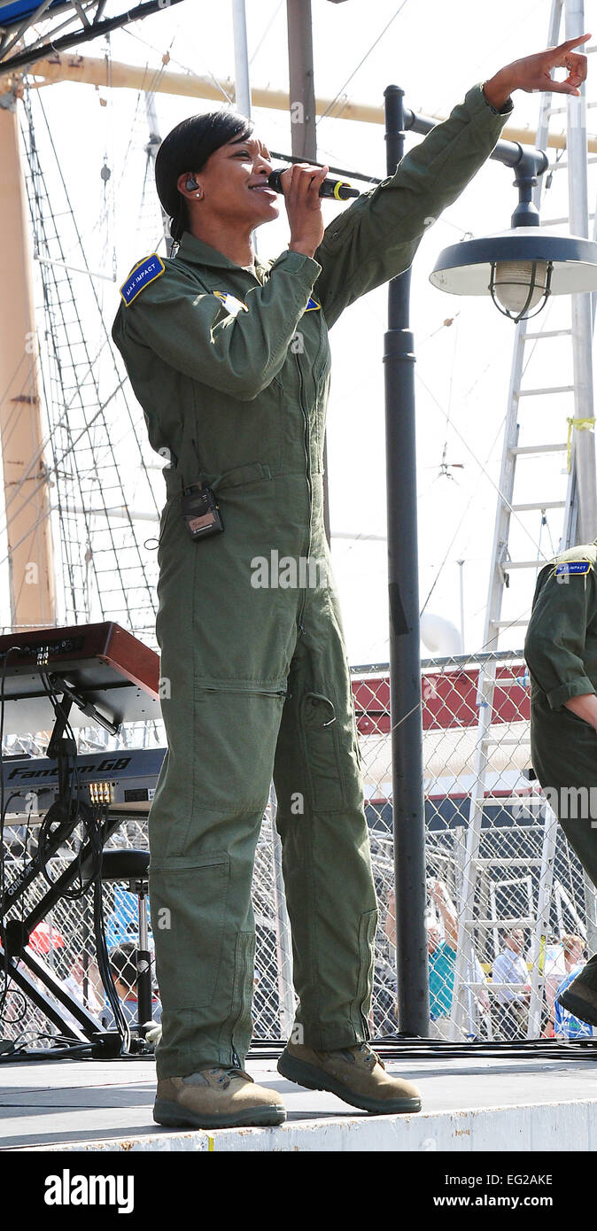 Master Sgt. Shani Prewitt, female vocalist for Max Impact, performs ...