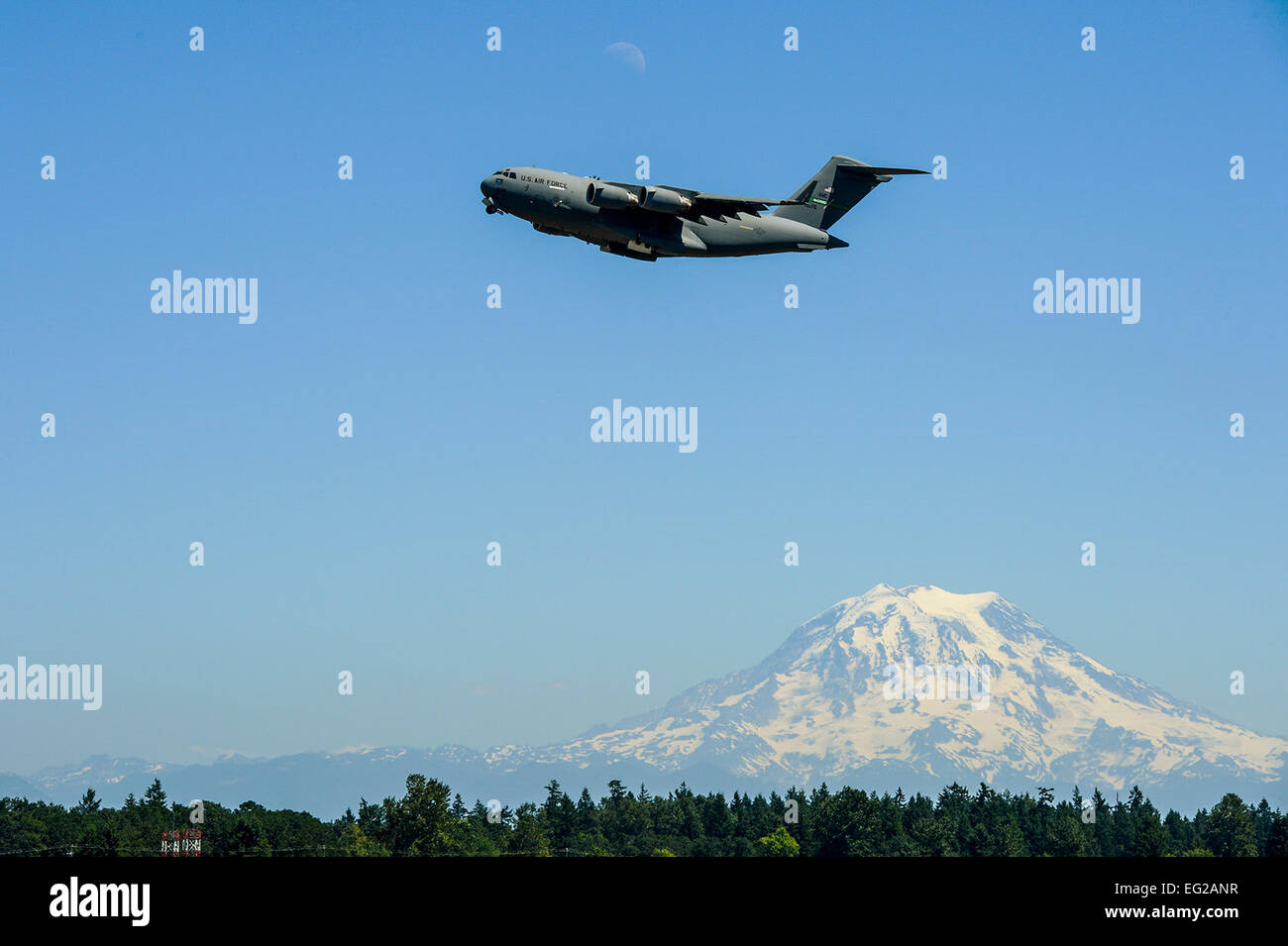 A C-17 Globemaster III ascends over Joint Base Lewis-McChord, Wash., as ...