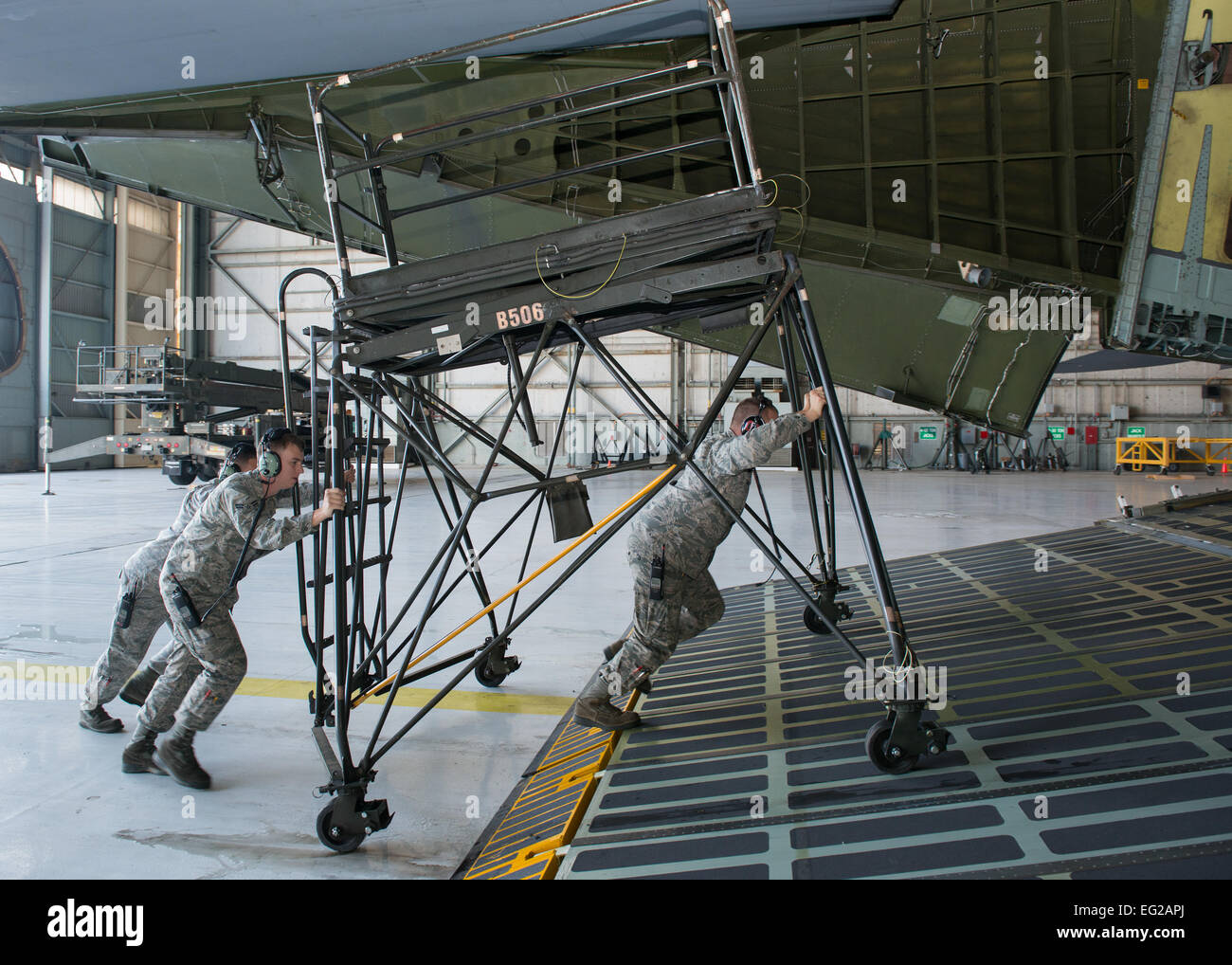 Crew members from the 60th Aircraft Maintenance Squadron load a B5 ...