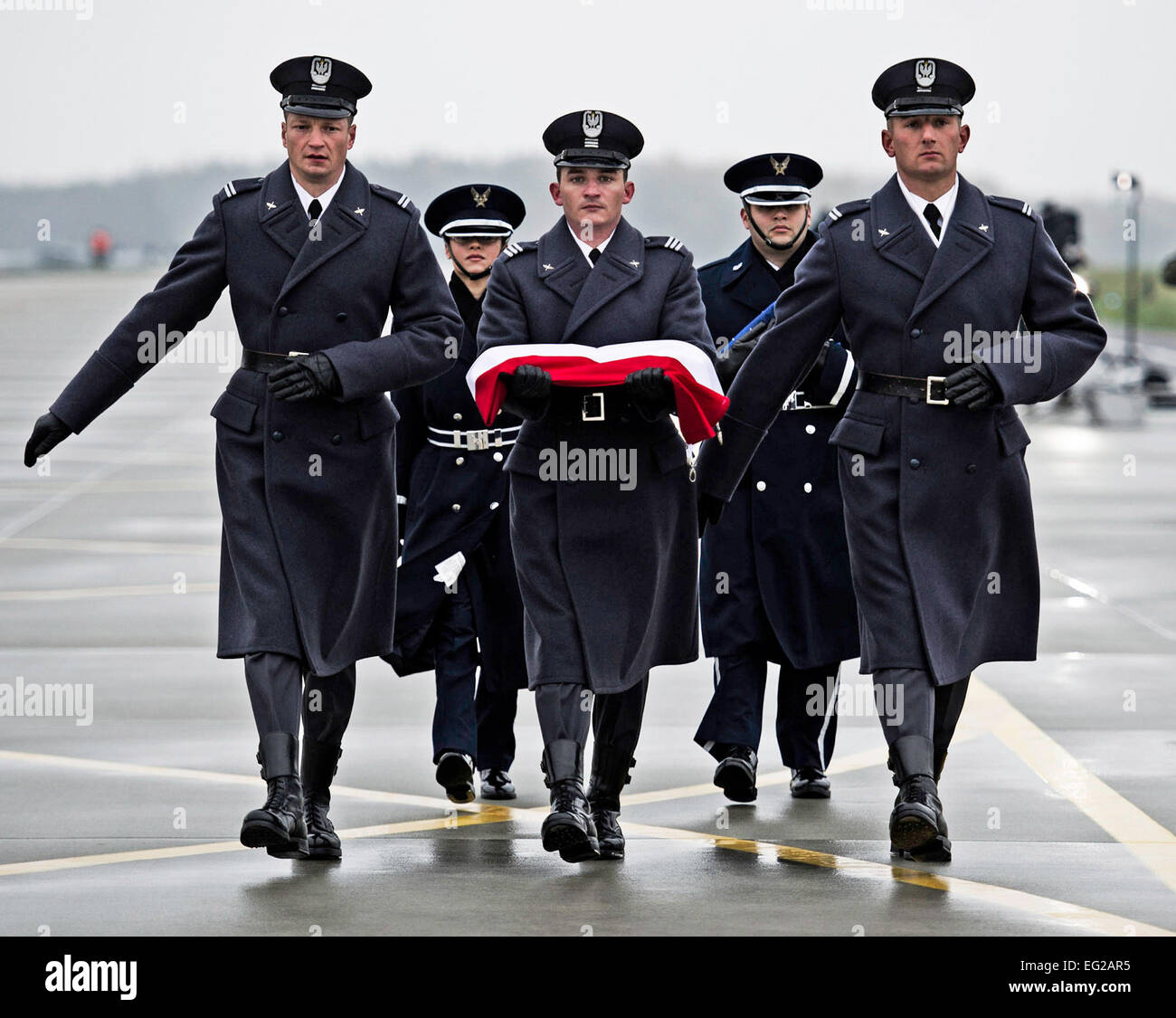 Polish and U.S. Air Force honor guard march to the flag poles during ...