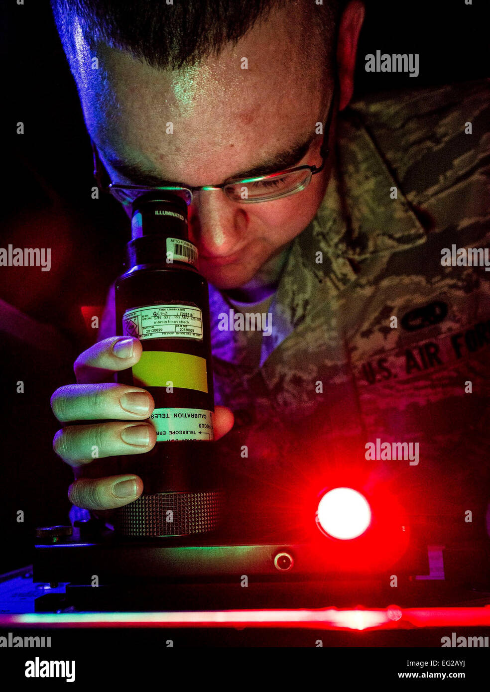 Senior Airman Nicholas Macdonald performs a night-vision goggle ...