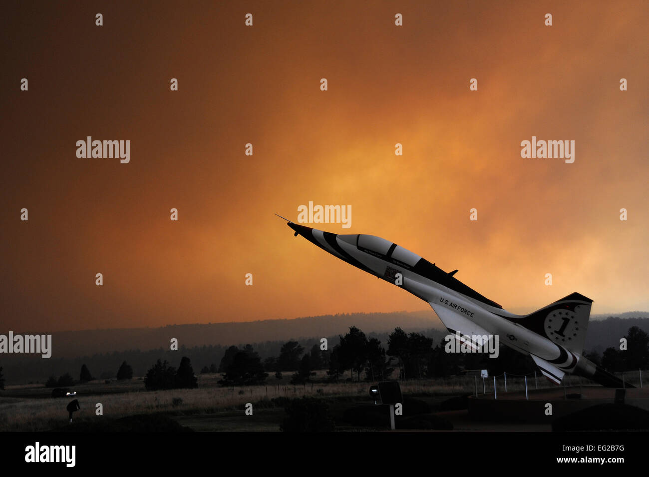 A rapidly spreading smoke cloud surrounds the U.S. Air Force Academy's ...