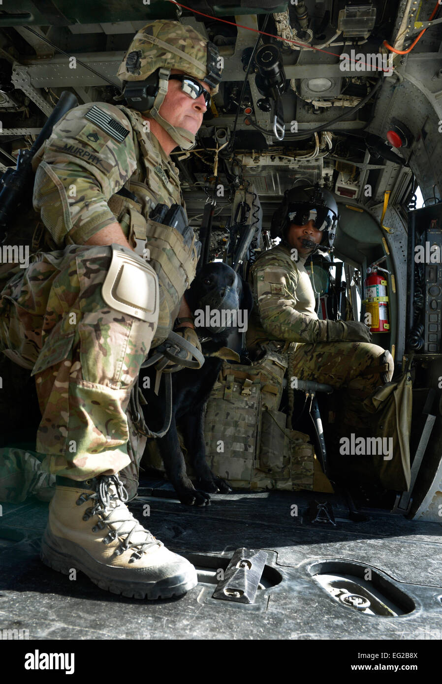 A pararescueman and Army tactical explosive detection dog handler ...