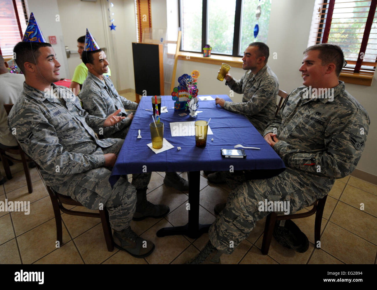U.S. Air Force Airmen sit at a table after eating lunch at the Air ...