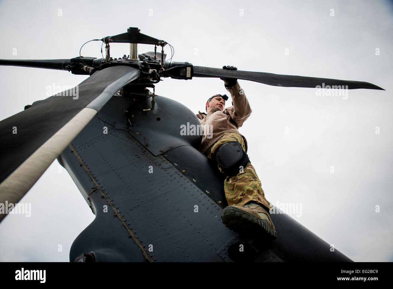 Tech. Sgt. Mathias Hauser, inspects the rotor blades of an HH-60G Pave ...