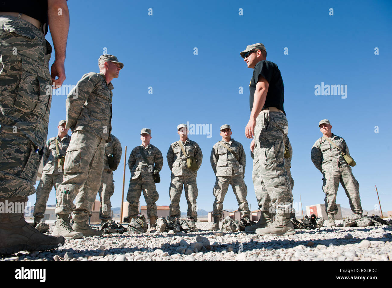 A Ranger Assessment Course instructor right, informs the class leader ...