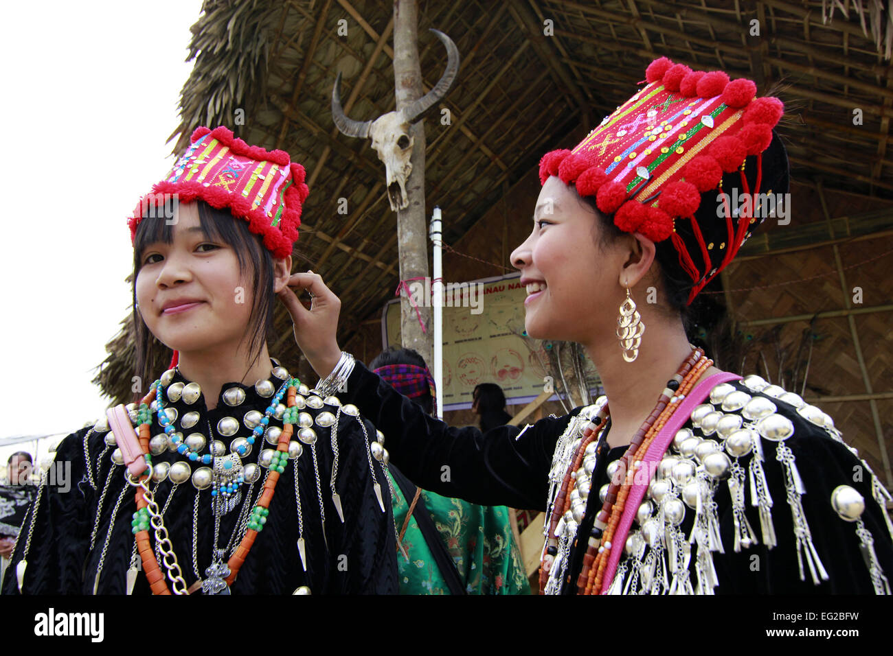 Sivasagar, Assam, India. 14th Feb, 2015. Singpho tribal girls prepares ...