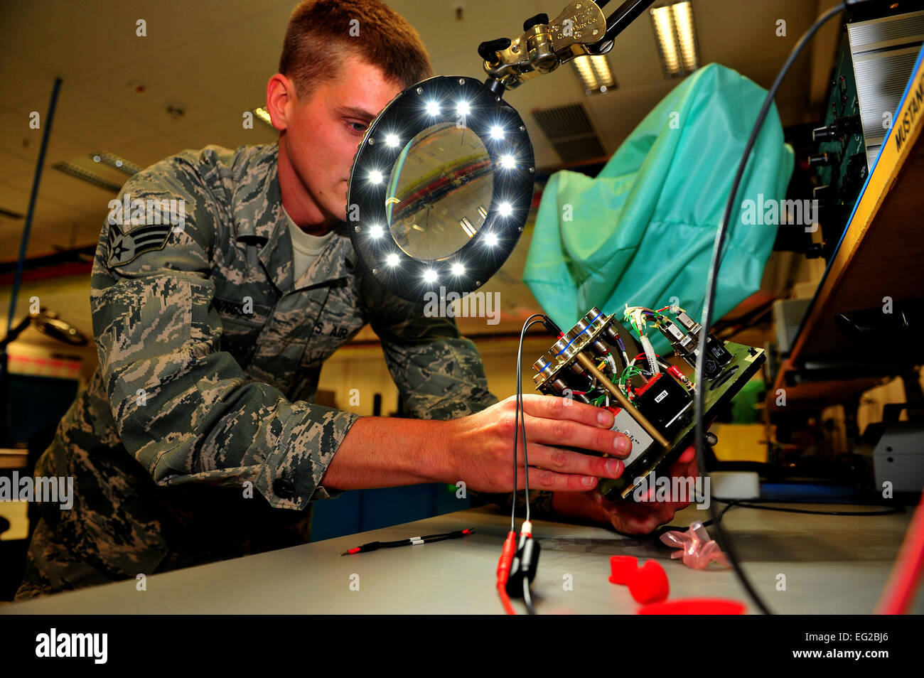 Senior Airman Andrew Jennings performs a functions check on the ...