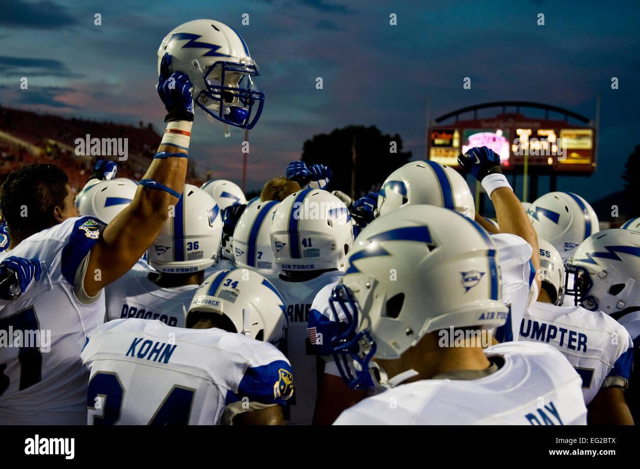 U.S. Air Force Academy Falcons football players get in a huddle before ...