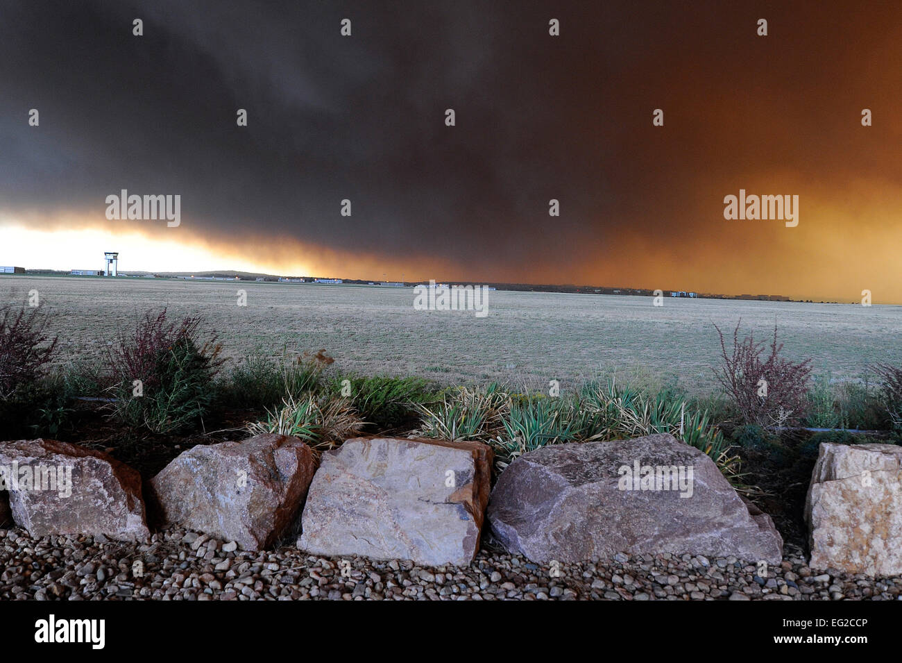 A rapidly spreading smoke cloud surrounds the U.S. Air Force Academy's ...
