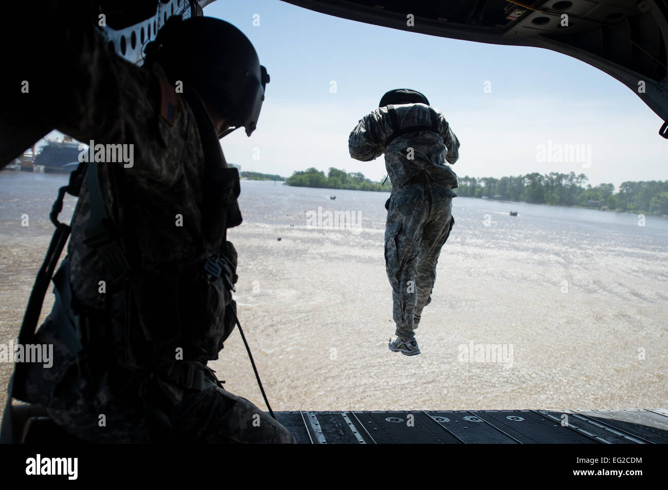 A U.S. Soldier with the 20th Special Forces Group jumps from a CH-47 ...