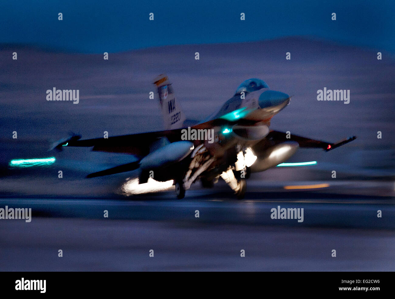 An F-16 Fighting Falcon aircraft takes off for a night mission at ...