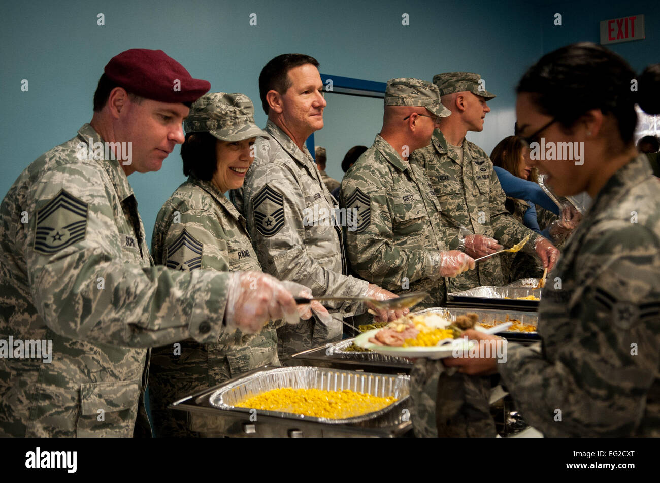 Senior NCOs and officers serve food to Airmen during the Thanksgiving ...