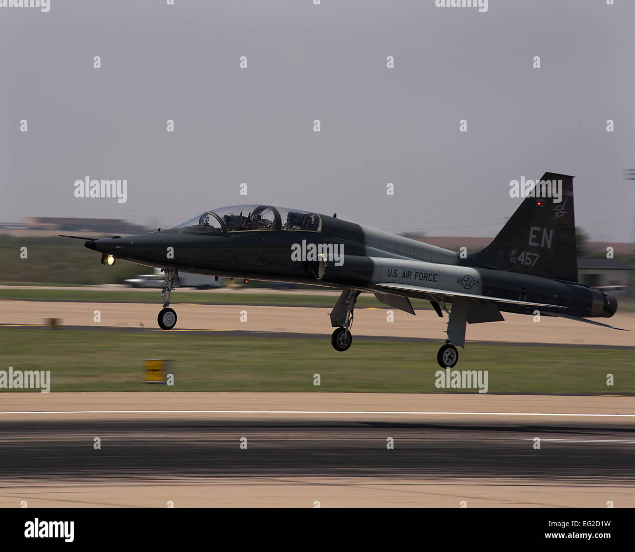 Pilots practice touch-and-go maneuvers in a T-38 Talon during training ...