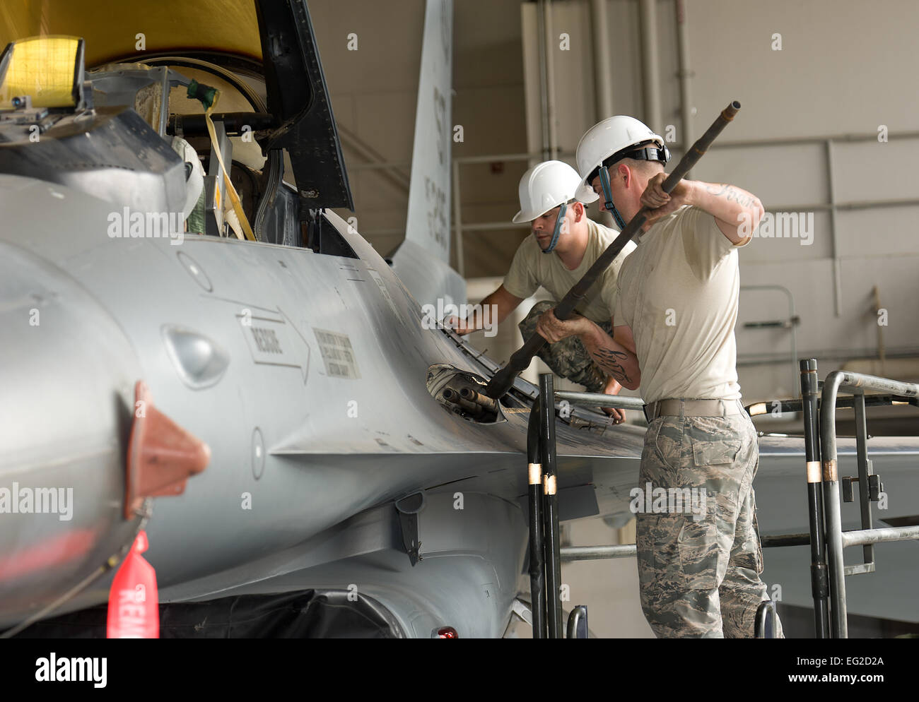 Tech. Sgts. Hunter Pettit and Shiloh Blanco remove and install an M61A1 ...