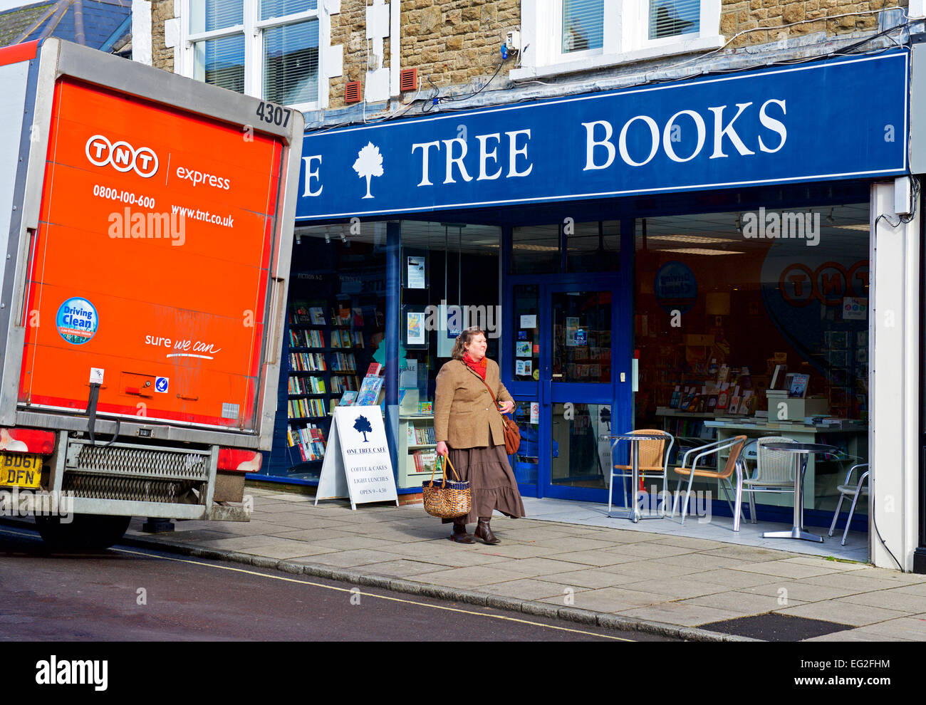 Lady walking past One Tree Books, an independent bookshop in ...