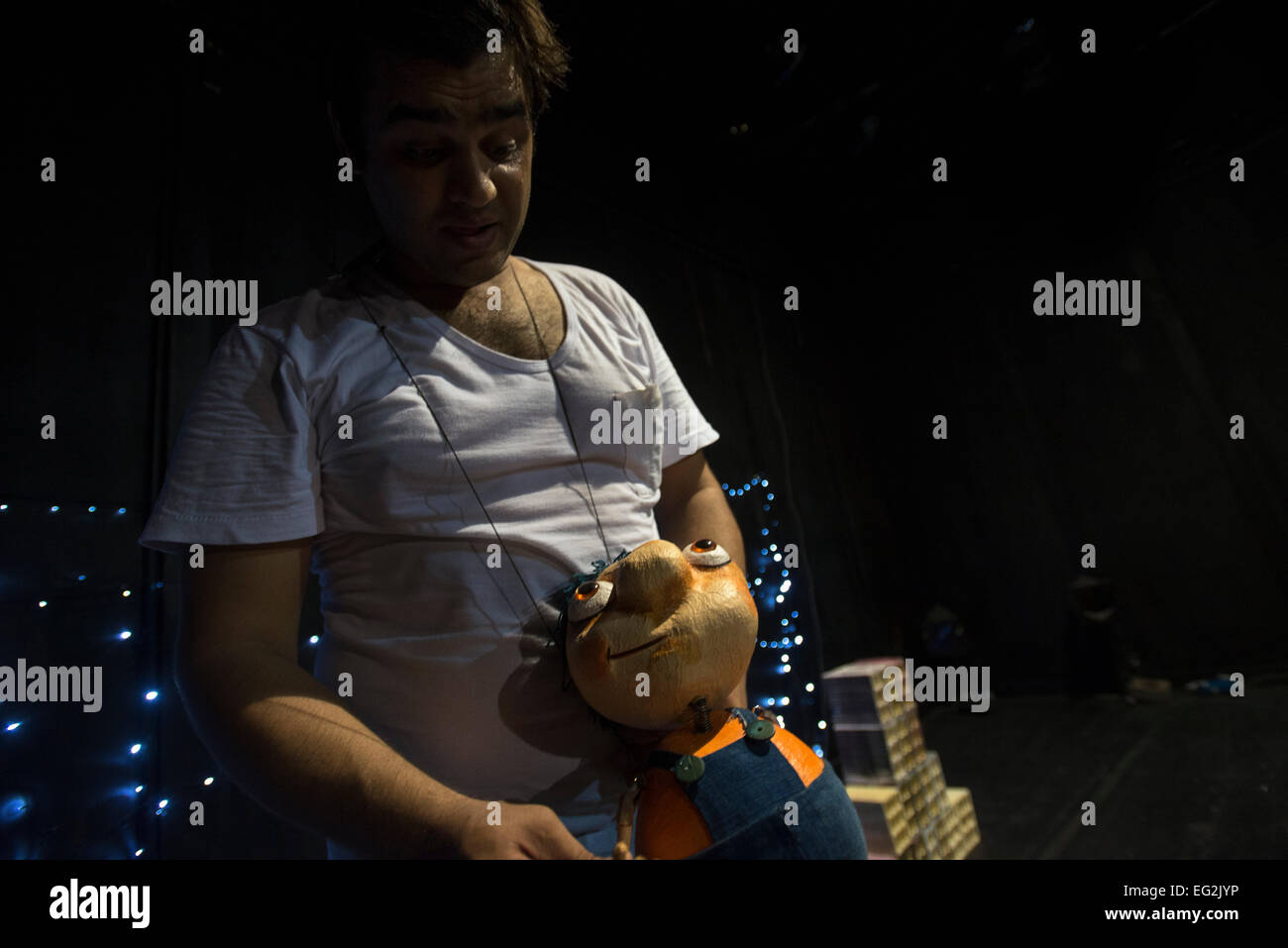 Actor shows his male doll after the performance "I'll return beside the ...