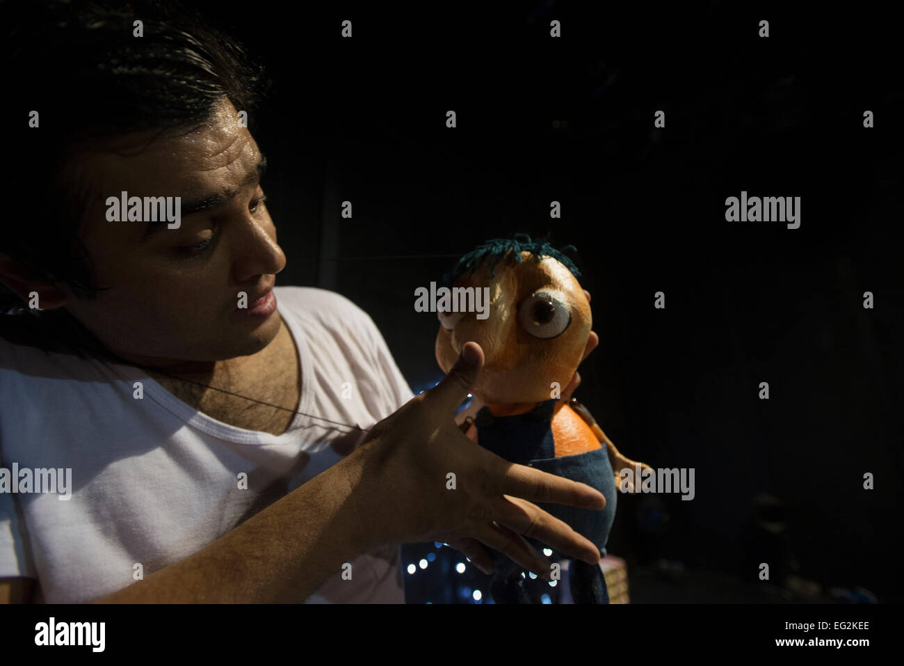 Actor shows his male doll after the performance "I'll return beside the ...