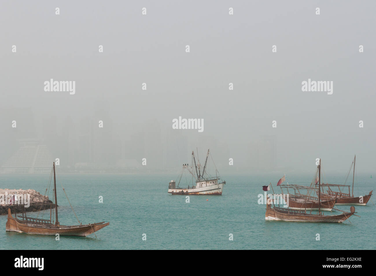 Boats (Dhow) in the sea in Doha, in a sandstorm, Qatar Stock Photo - Alamy