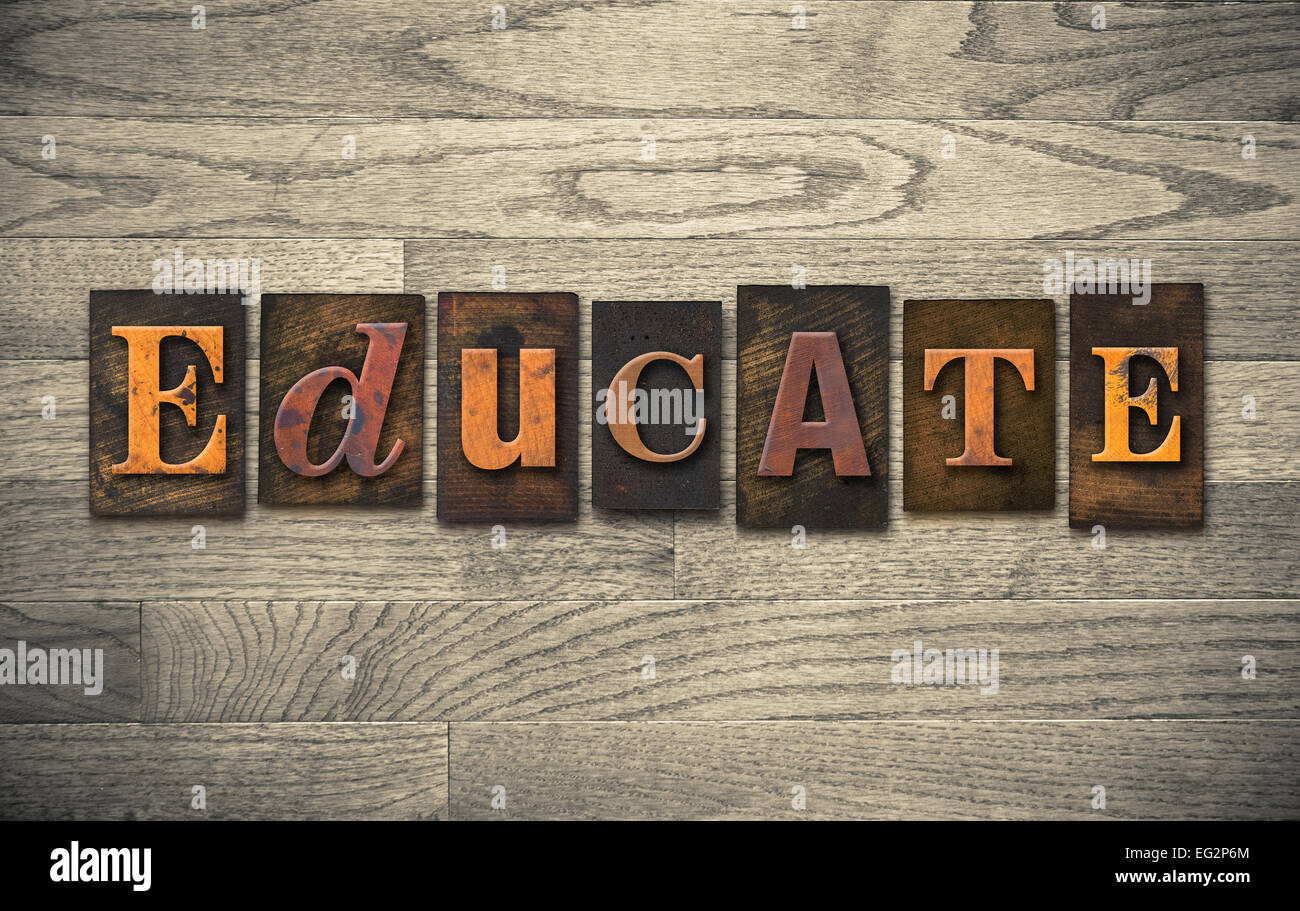 The word "EDUCATE" written in vintage wooden letterpress type Stock ...