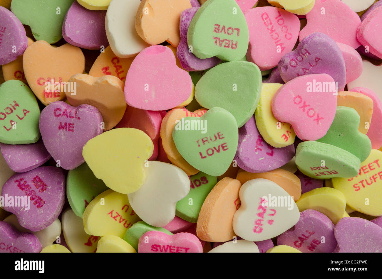 Multi colored candy with sweet romantic messages Stock Photo - Alamy
