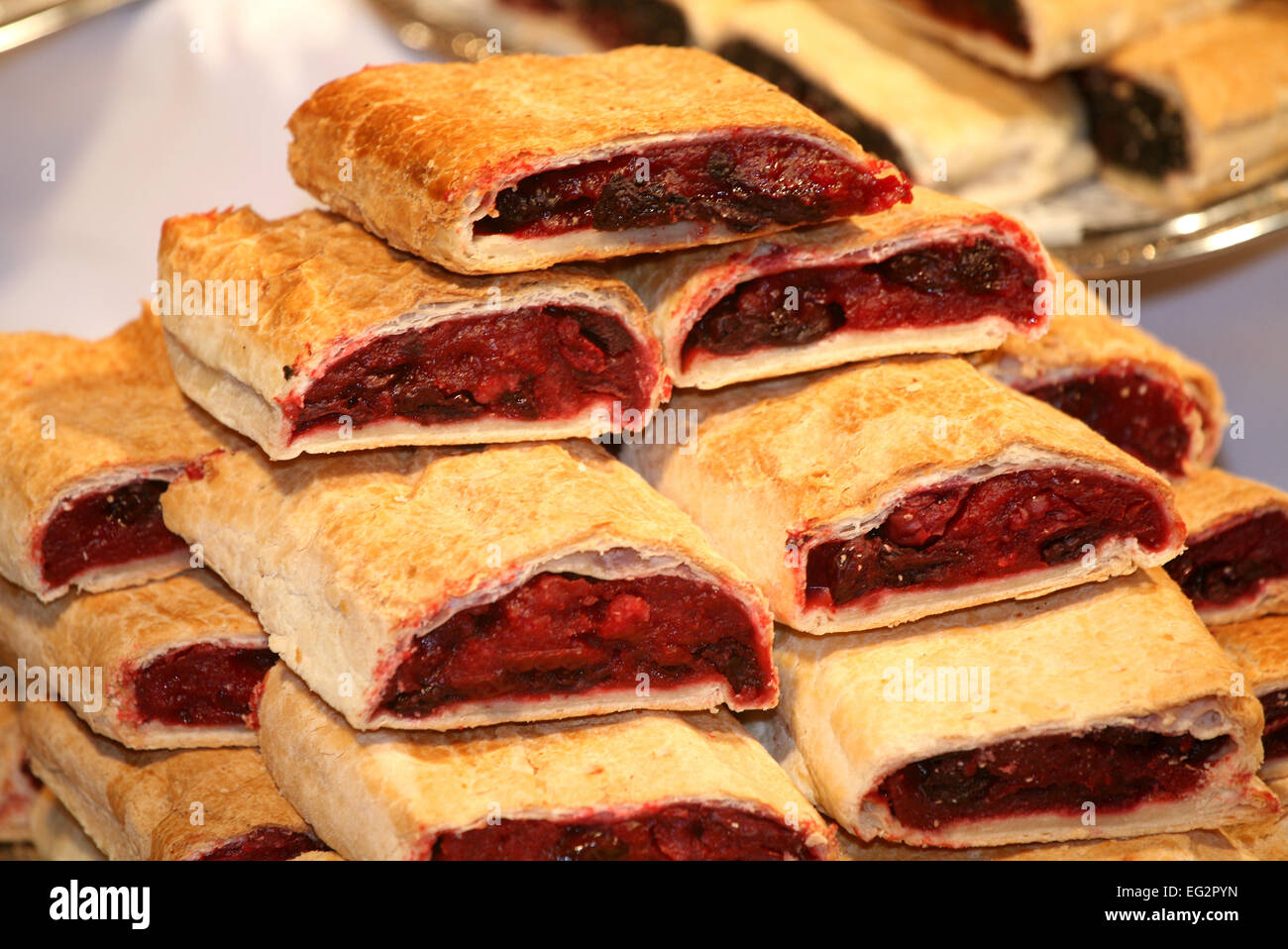 Group of cherry strudels close up as a background. Hungarian retes ...