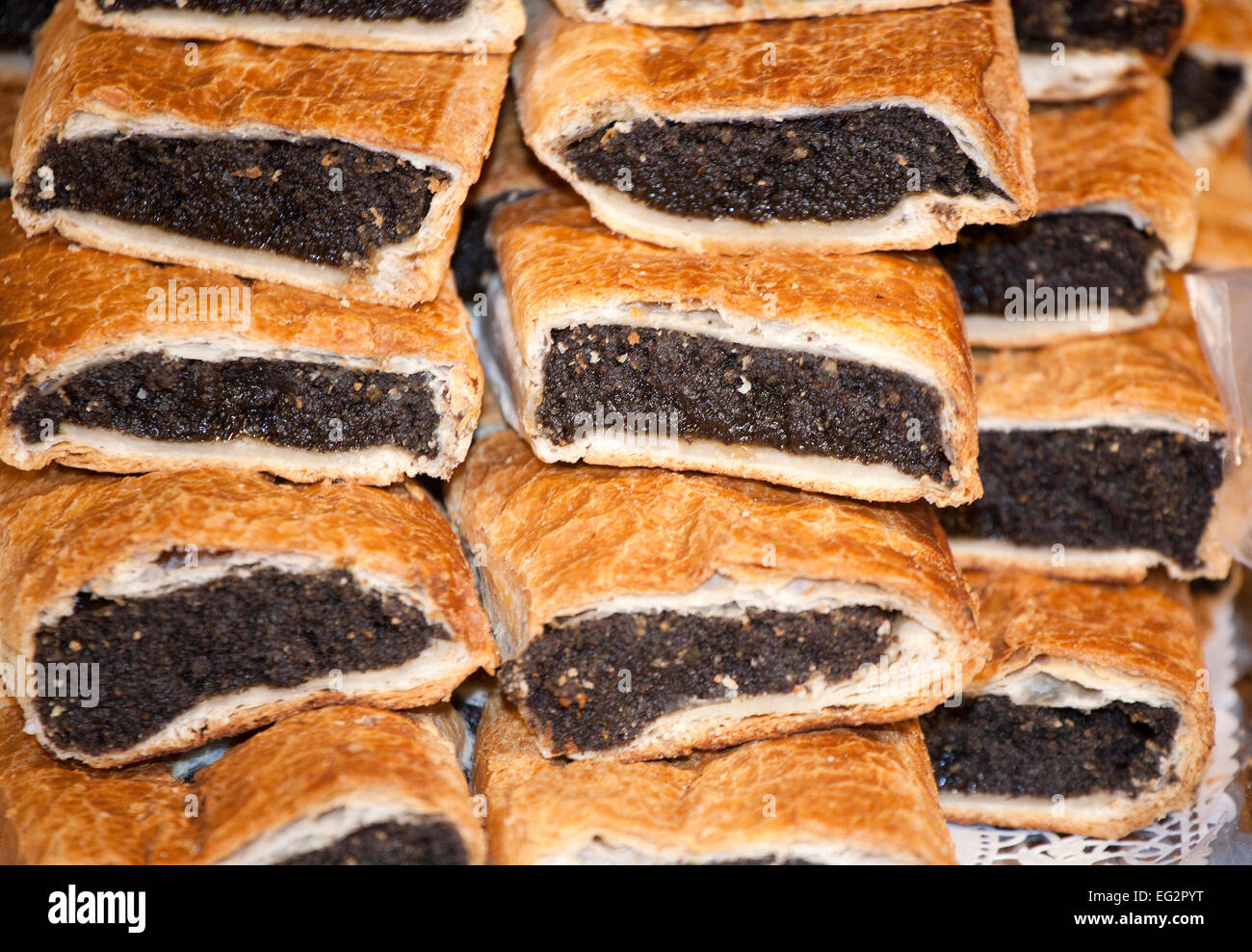 Group of cherry strudels with white dishes close up as a background ...