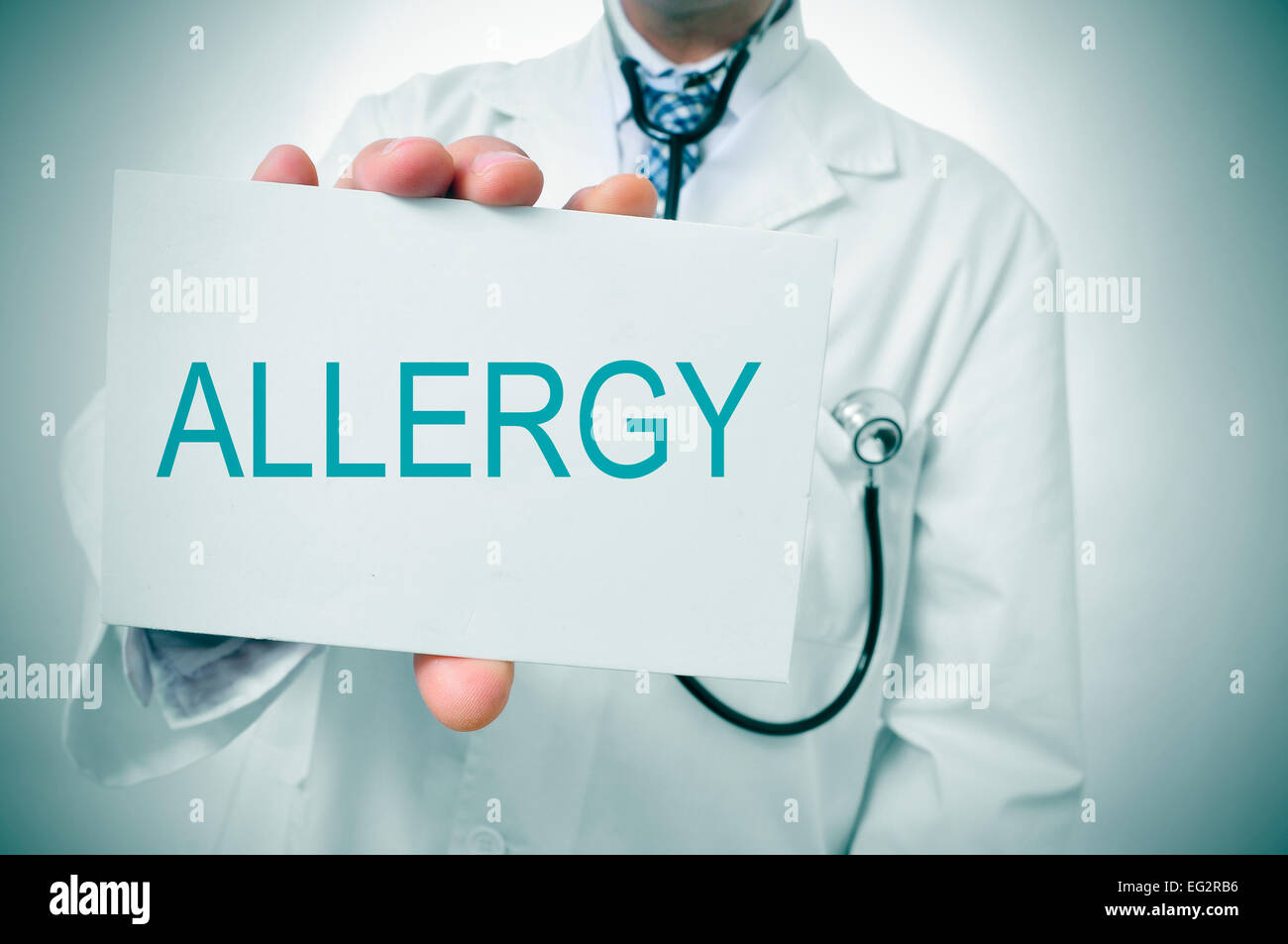 a doctor showing a signboard with the word allergy written in it Stock ...