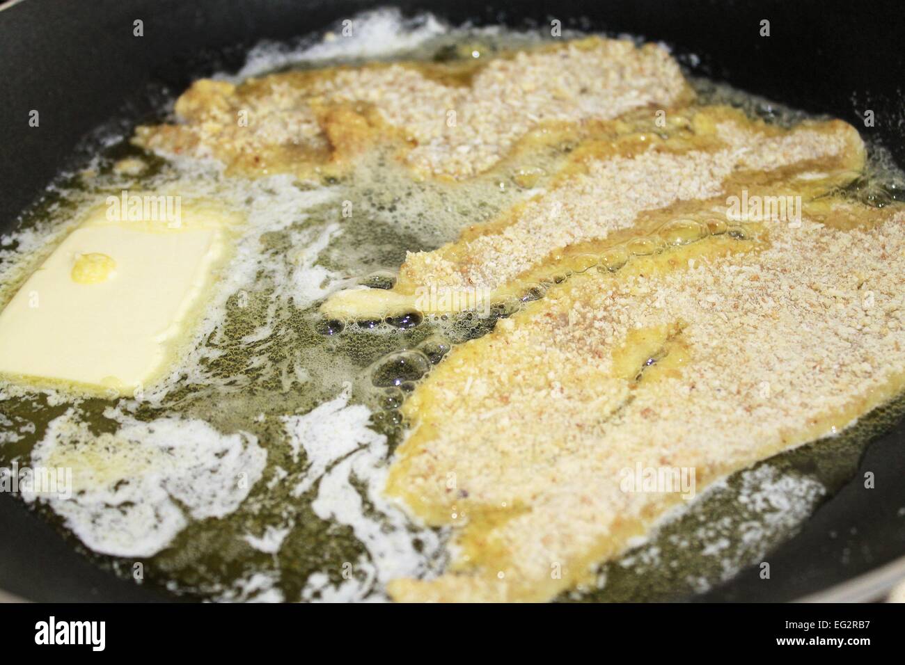 beef breaded with butter cooking in pot Stock Photo - Alamy