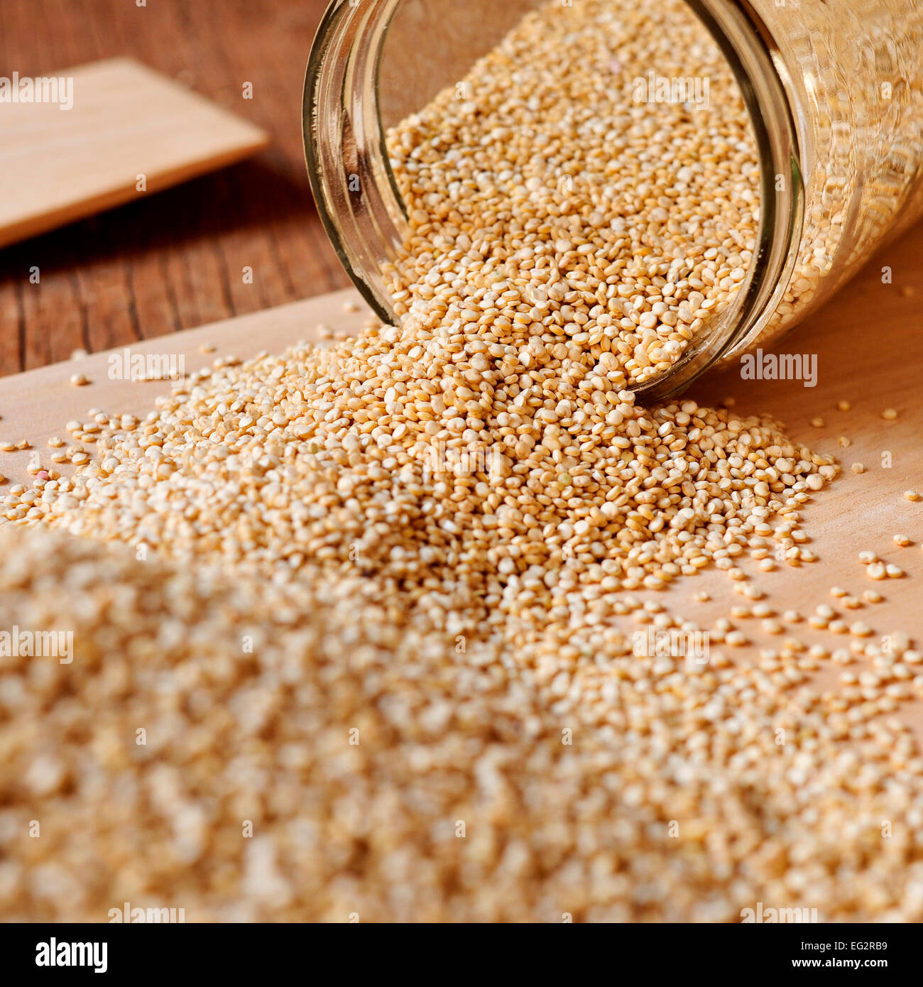 quinoa seeds coming out from a glass jar Stock Photo - Alamy