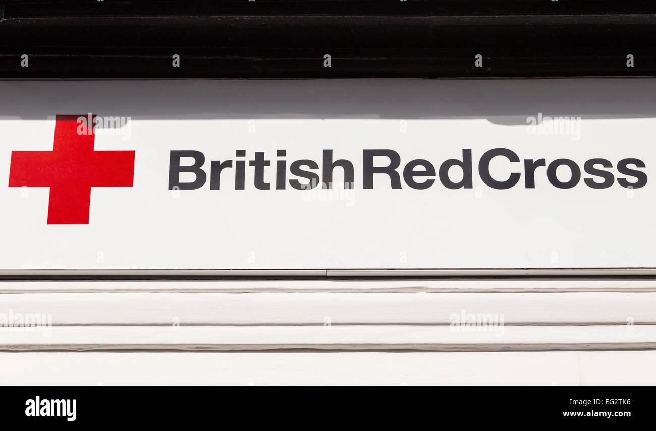 A British Red Cross sign on a shop front in sunshine Stock Photo - Alamy