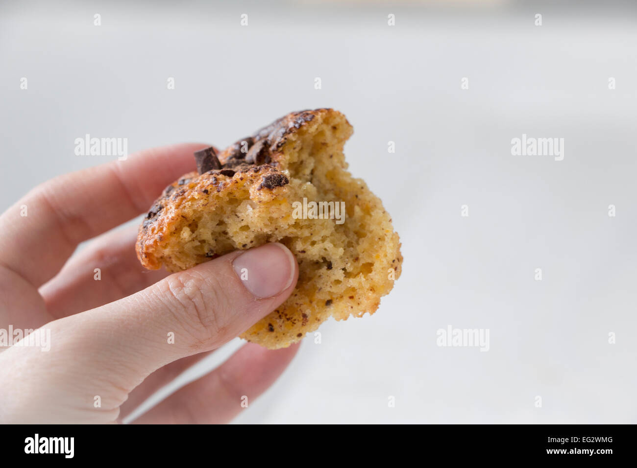 Eating a muffin. Fabulous treat Stock Photo - Alamy