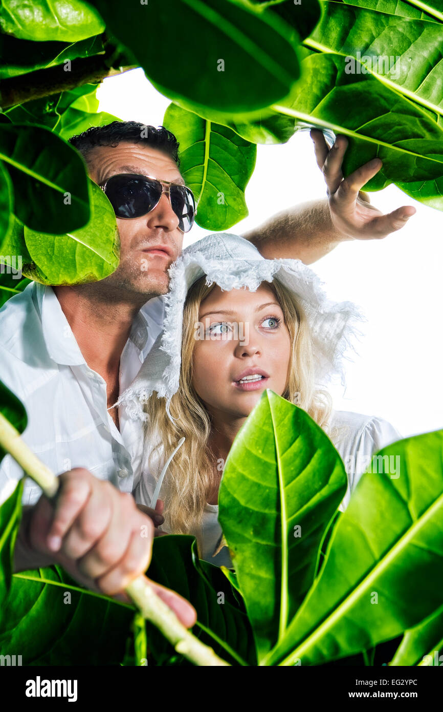 Portrait of young nice couple having good time inj tropic environment ...