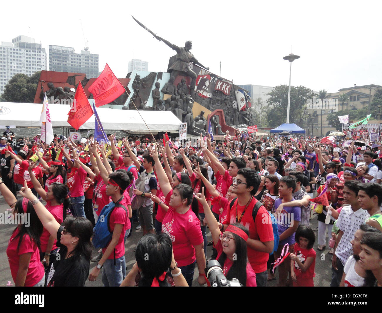 Filipinos point up to the sky as they dance the 'One Billion Rising ...
