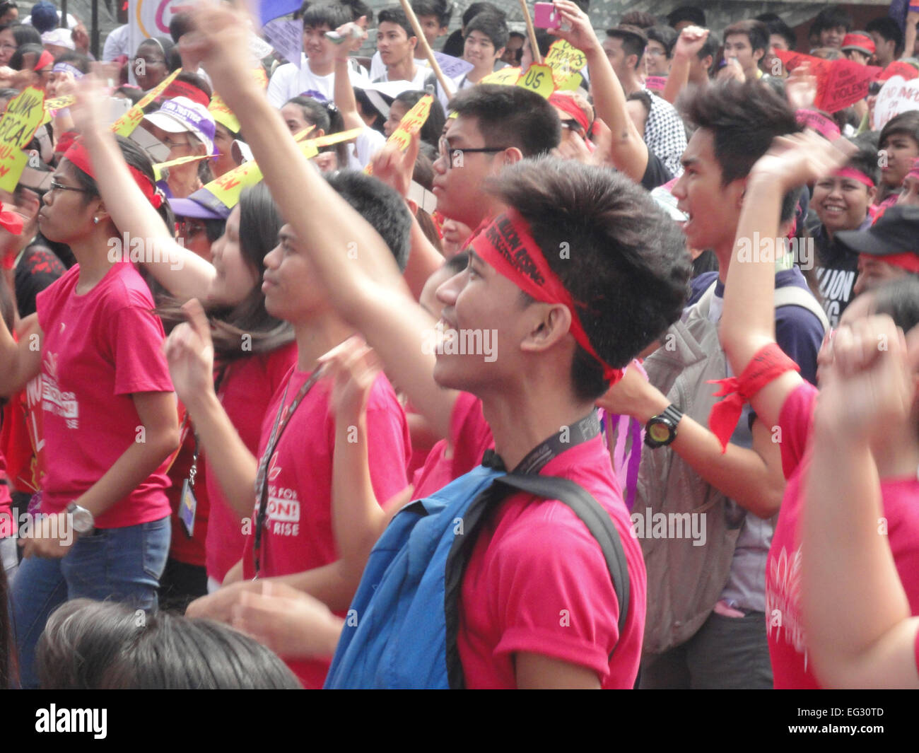 Filipinos point up to the sky as they dance the 'One Billion Rising ...