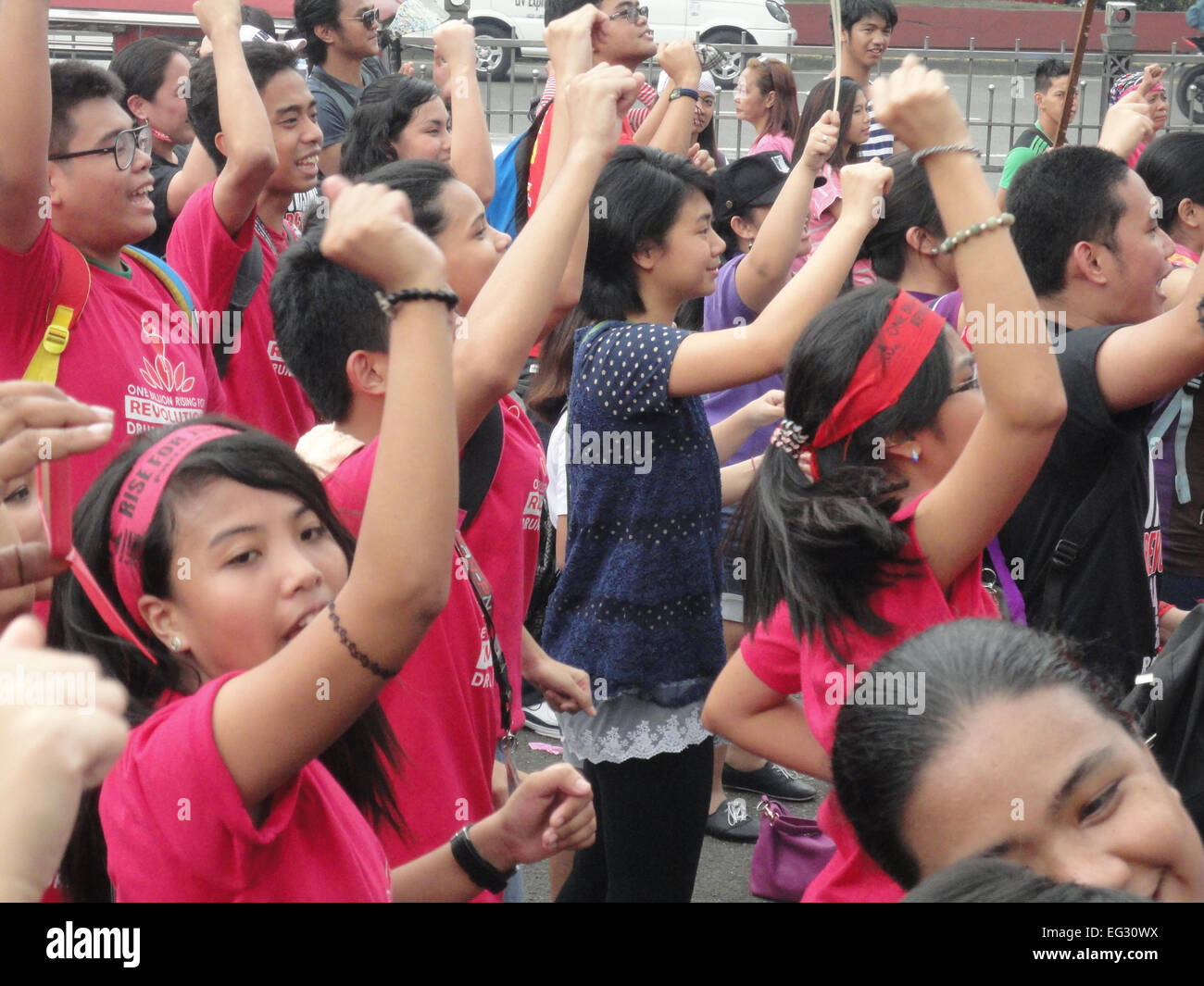 Filipino students wave their clenched fists as they dance the 'One ...