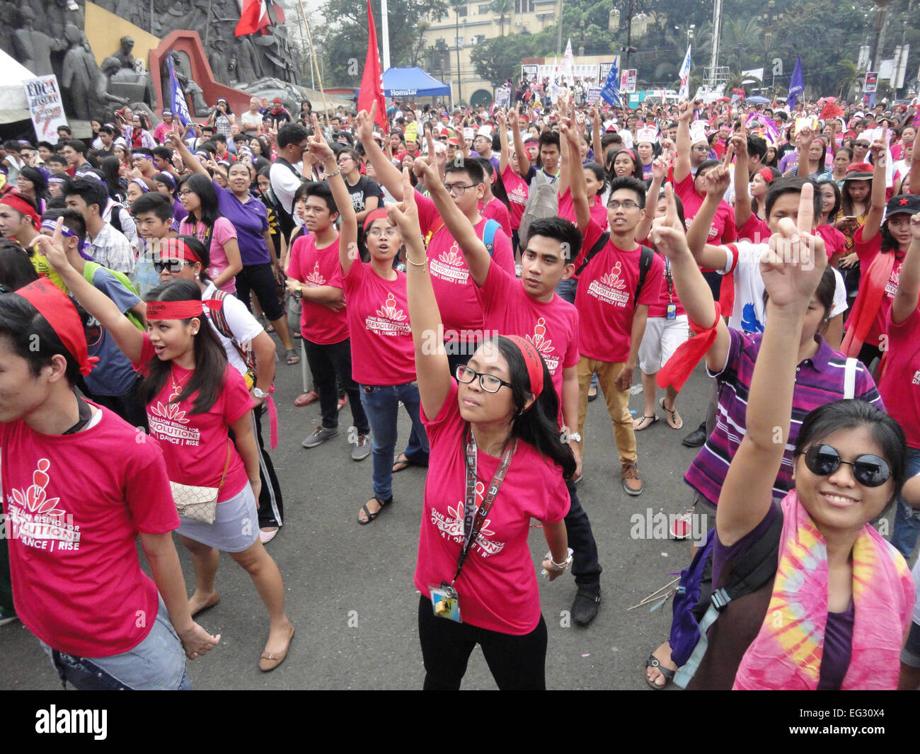 Filipinos point up to the sky as they dance the 'One Billion Rising ...