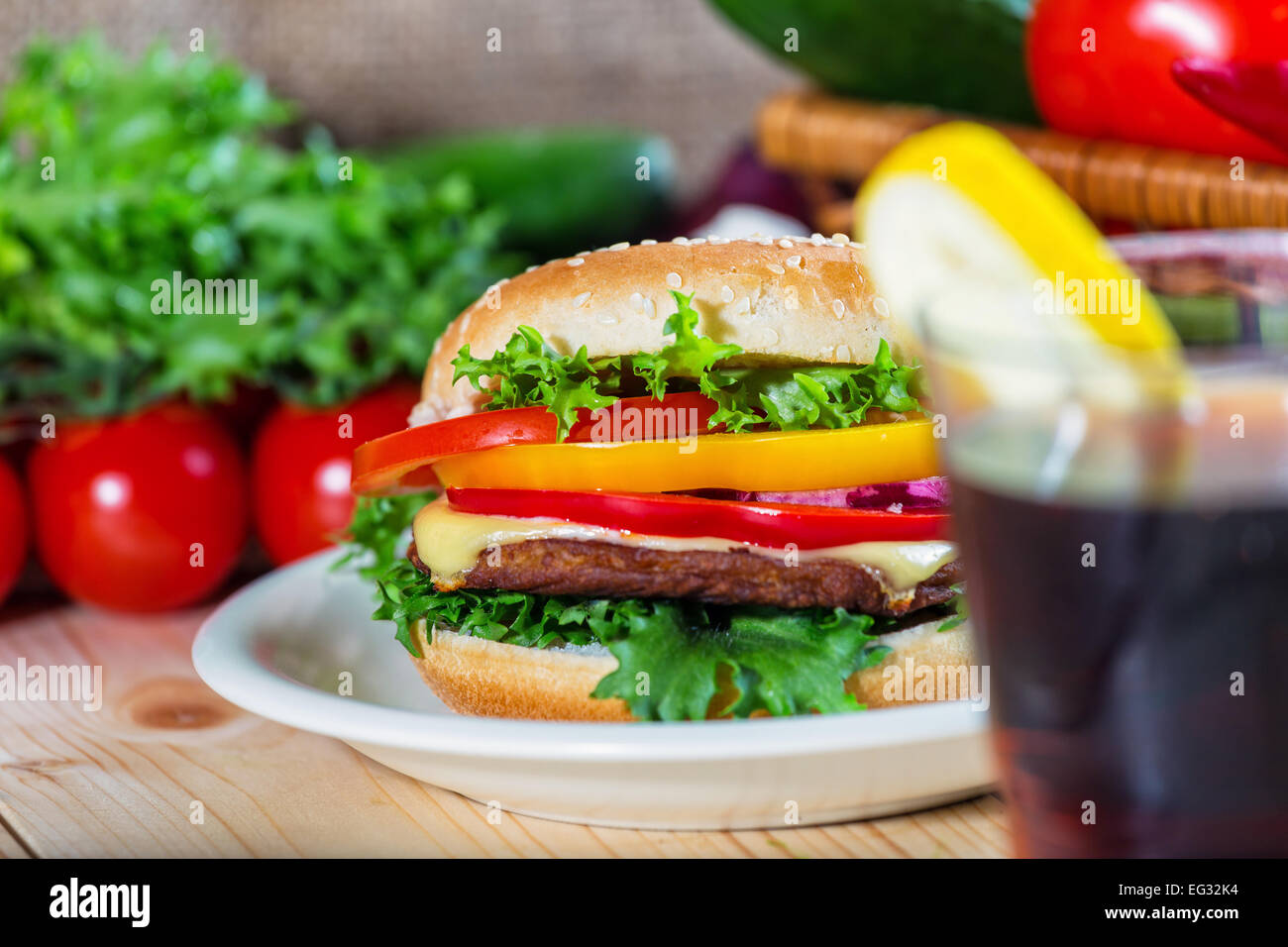 hamburger and drink with slice of lemon Stock Photo - Alamy