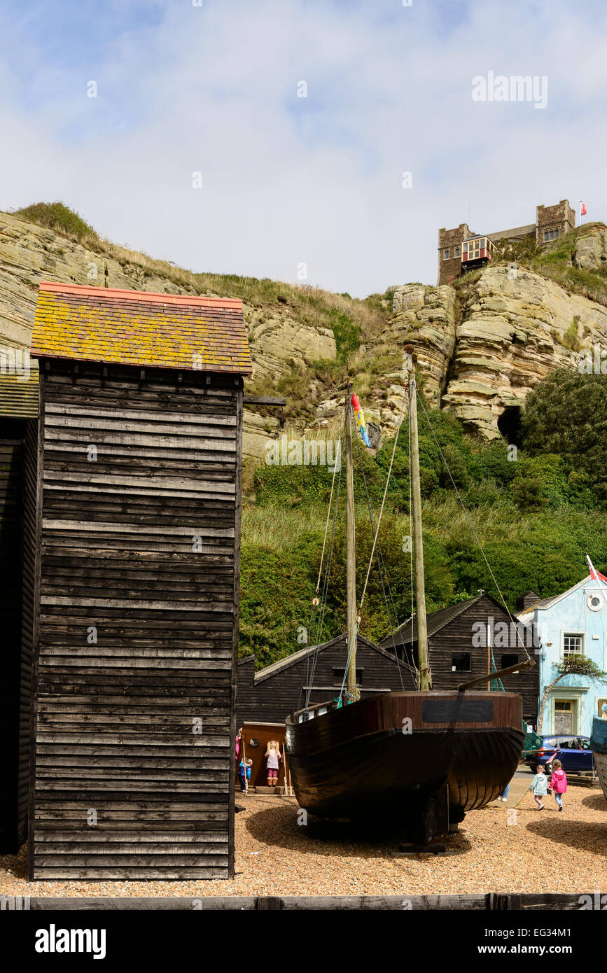 foreshortening of old fishing boat aground amid old net huts in ...