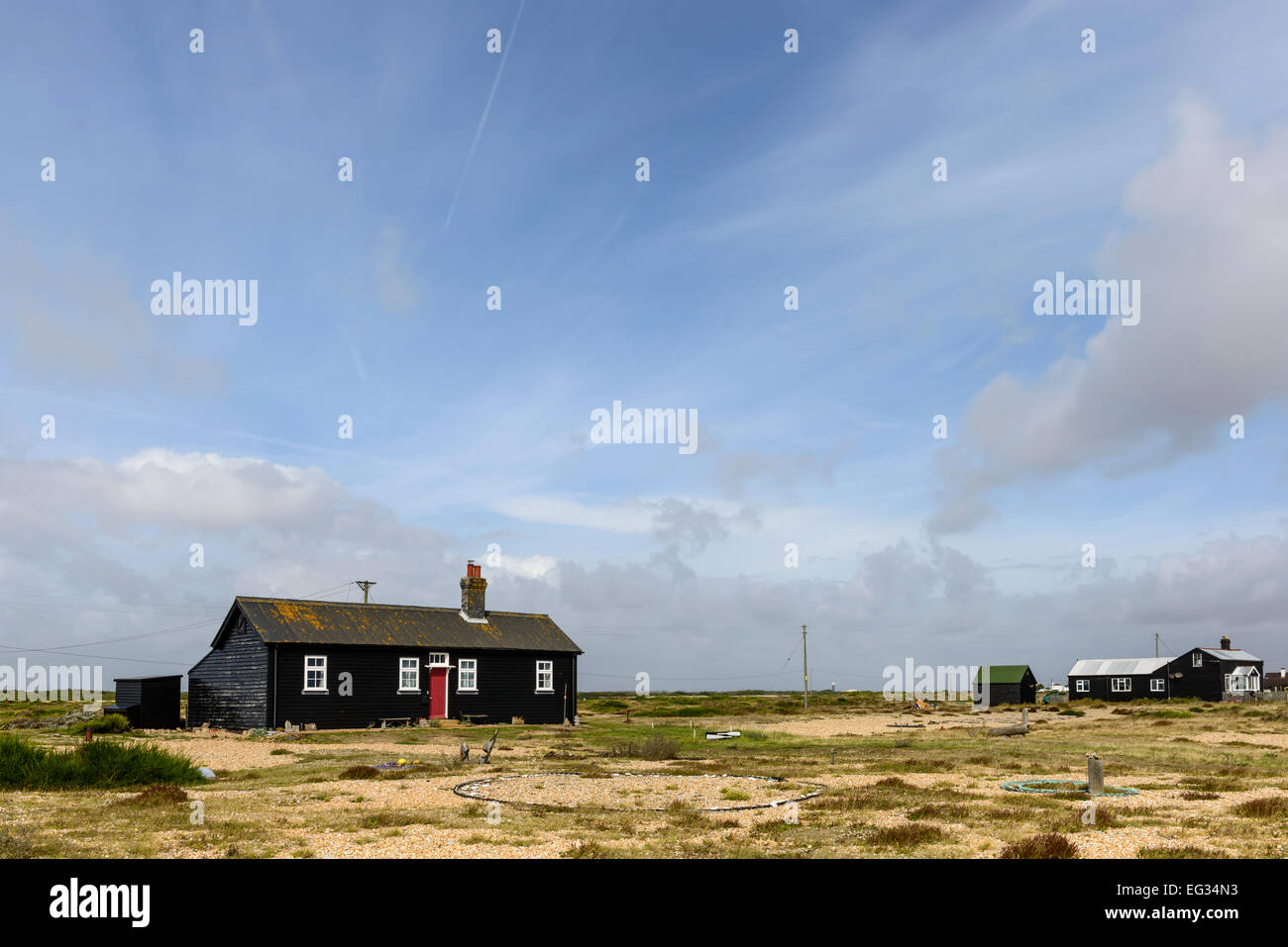 landscape of the marsh with holiday bungalow painted in black near the ...